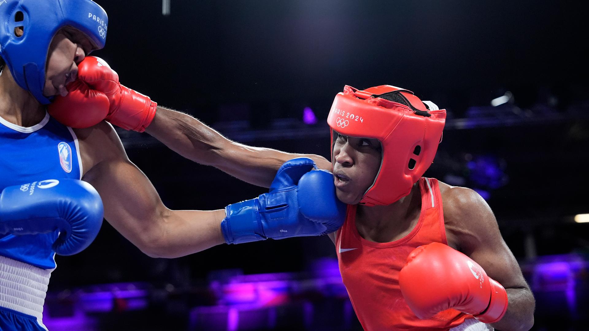 Boxer Cindy Ngamba becomes 1st on Refugee team to clinch medal | wzzm13.com