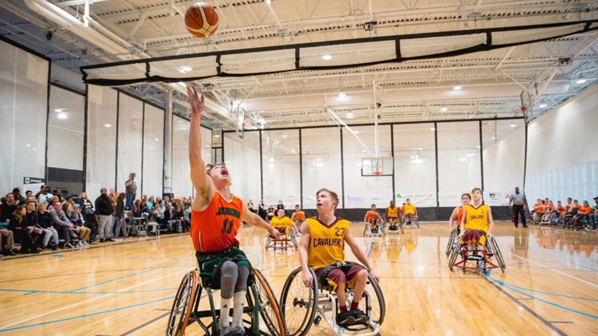 Nearly 100 athletes participate in youth wheelchair basketball ...