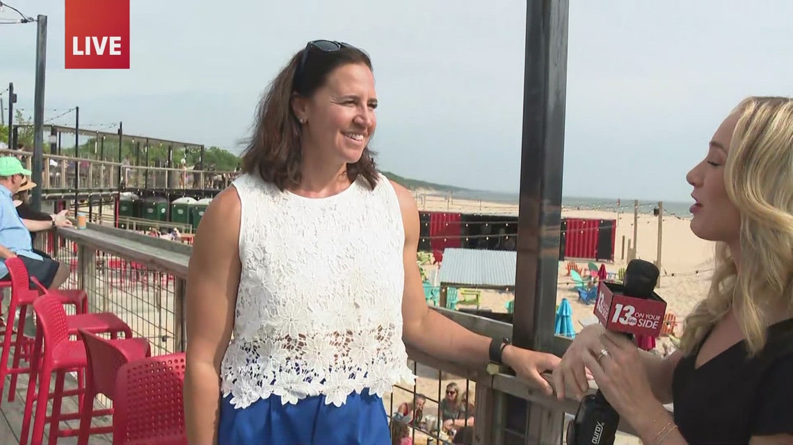 Meteorologist Samantha Jacques talks with owner of The Deck in Muskegon ...
