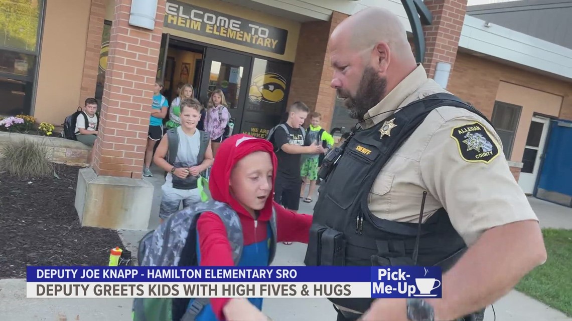 Hamilton Community Schools resource officer greets students with hugs ...