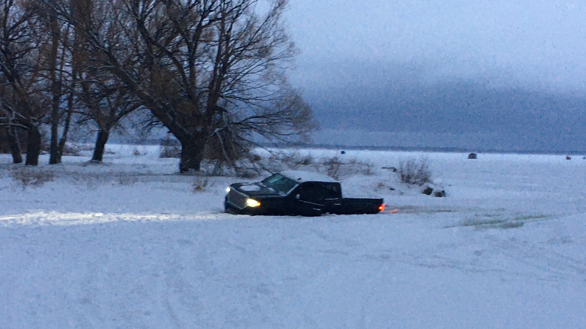 3 snowmobiles, 1 truck fall through thin ice in Northern Michigan ...