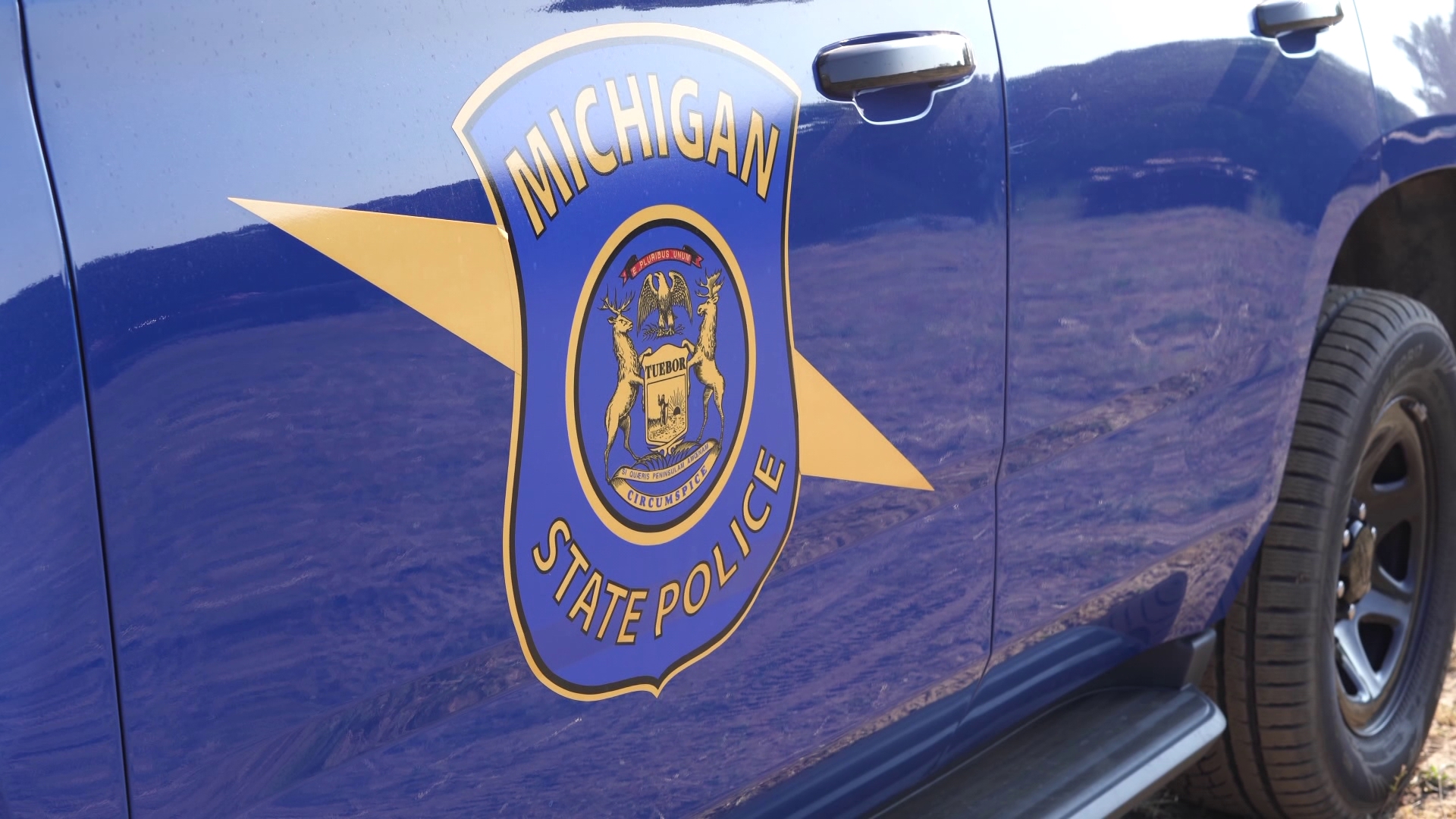 Michigan trooper escapes harm after being dragged by car | wzzm13.com