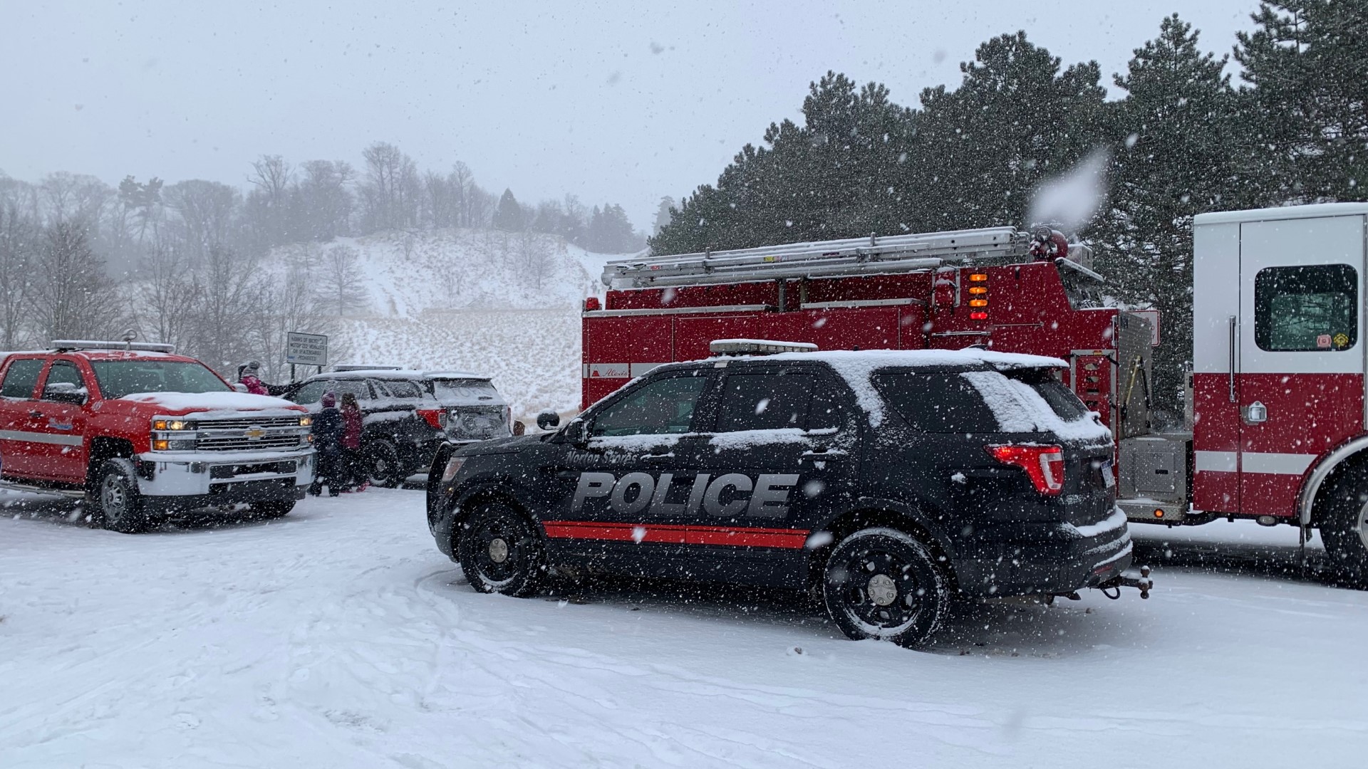 Norton Shores law enforcement surprises sledding families | wzzm13.com