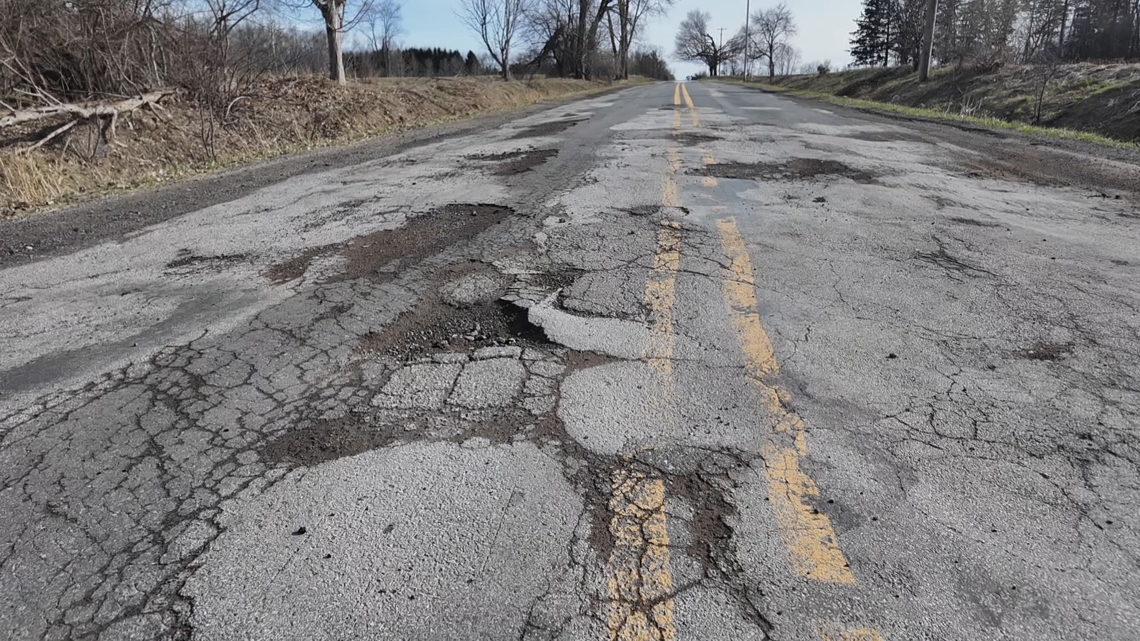 'IT'S A MOONSCAPE' | Potholes plague Muskegon County road | wzzm13.com
