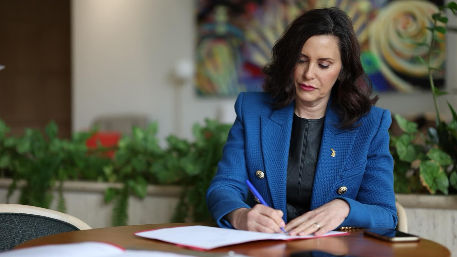 Whitmer signs education bills to add $125M to school budget | wzzm13.com