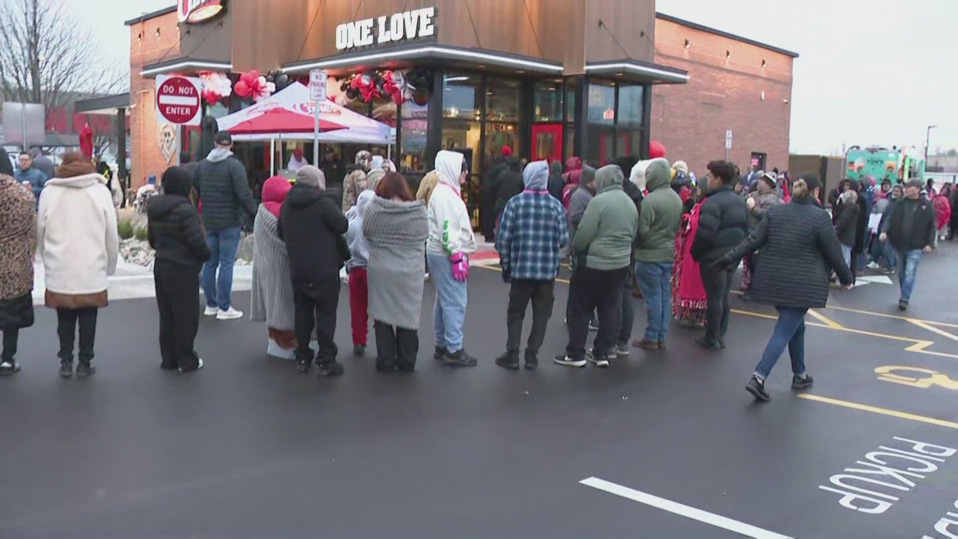 Crowds line up outside Raising Cane's opening in Kentwood | wzzm13.com