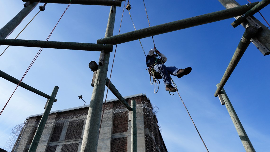 Michigan prison program trains inmates to trim around power lines ...