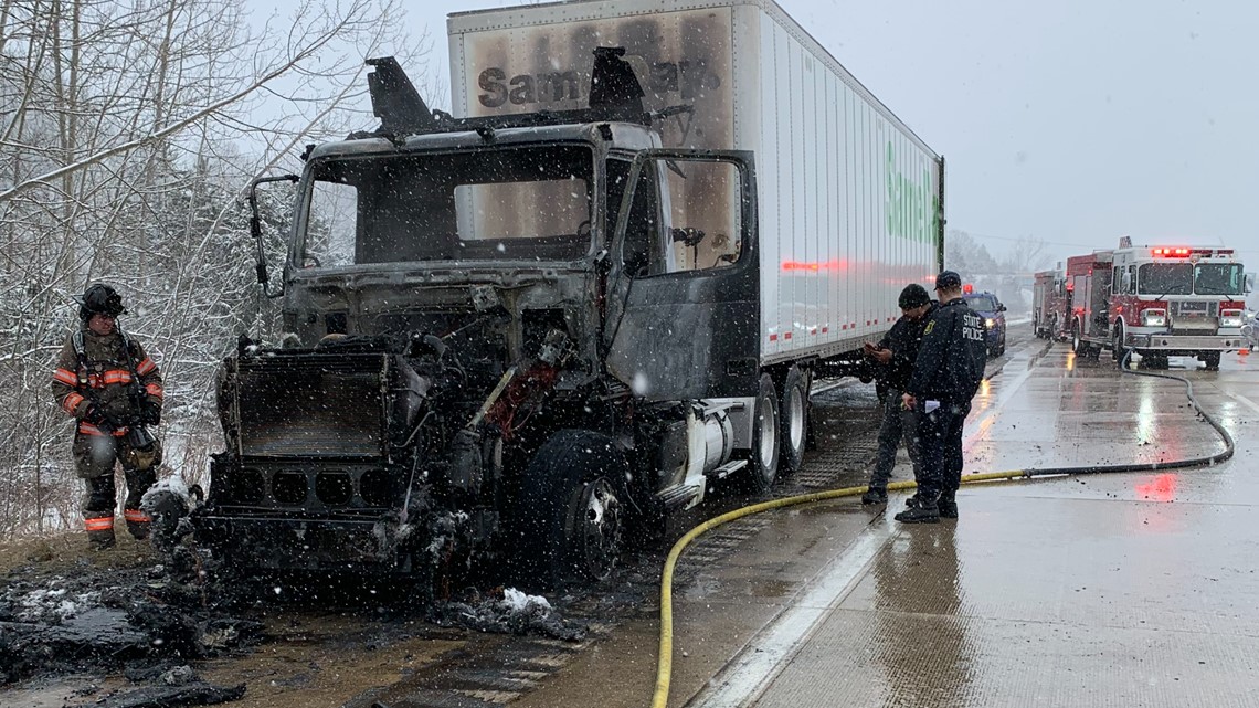 Semi-truck driver safe after truck catches fire on I-96 | wzzm13.com