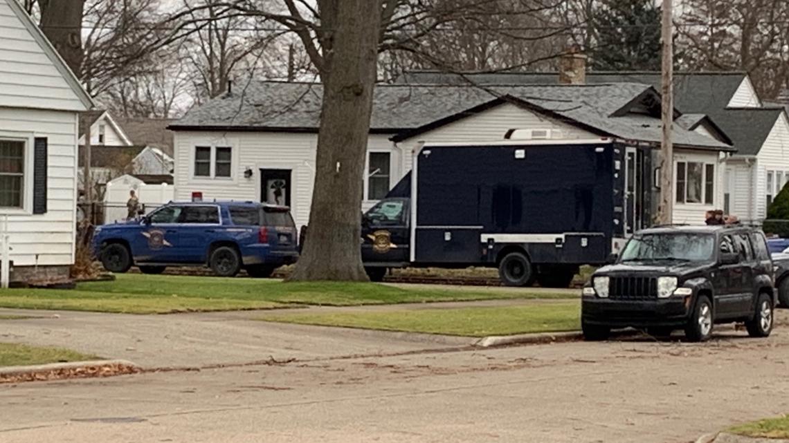 Police surround home in connection to bar shooting | wzzm13.com