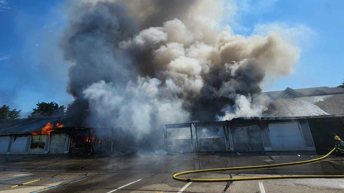 Crews work to extinguish large garage fire at Brookmeadow Apartments | wzzm13.com