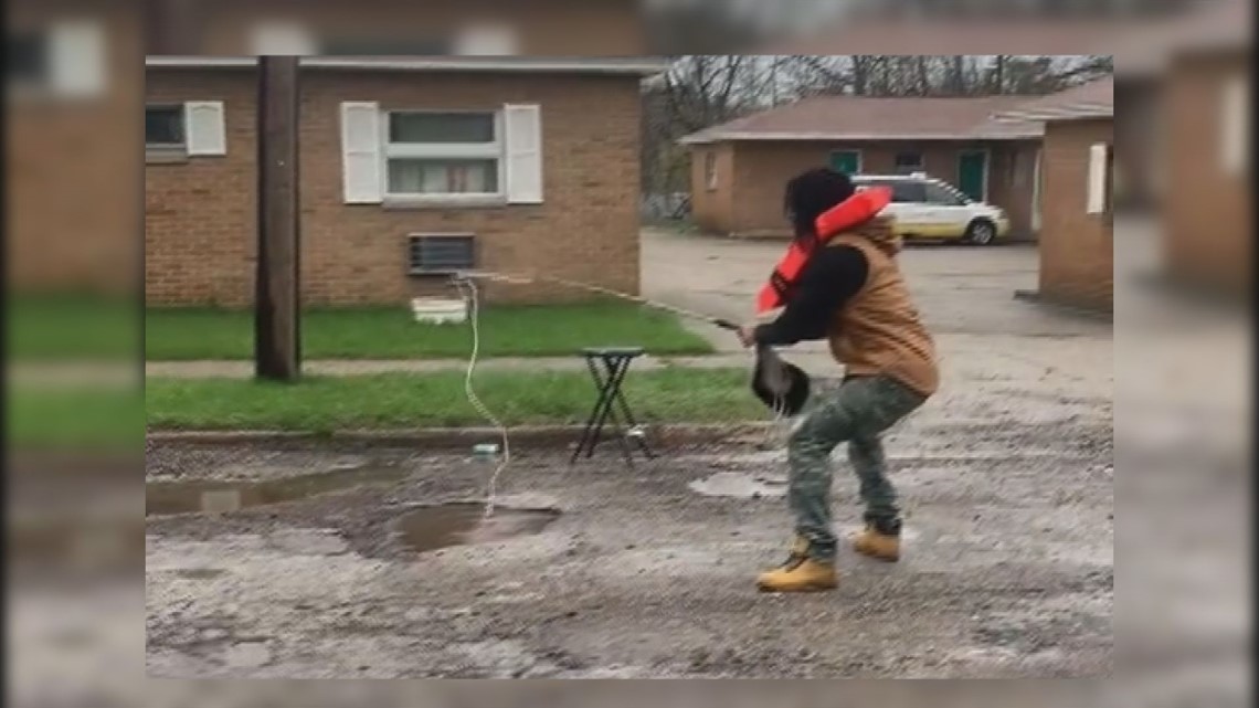 Man brings attention to poor roadways by 'fishing' from potholes ...