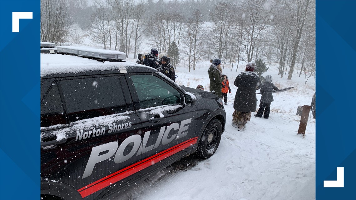 Norton Shores law enforcement surprises sledding families | wzzm13.com