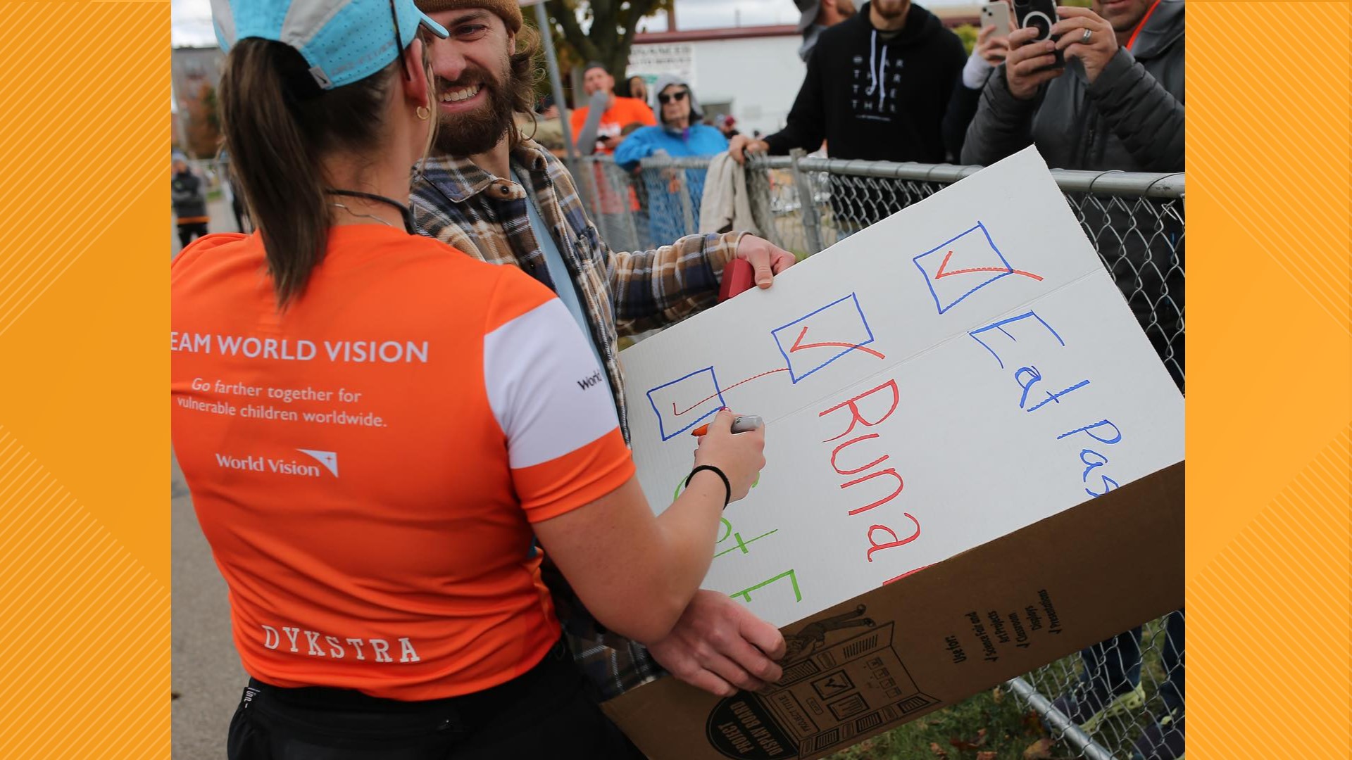 Couple gets engaged at finish line of Grand Rapids Marathon | wzzm13.com