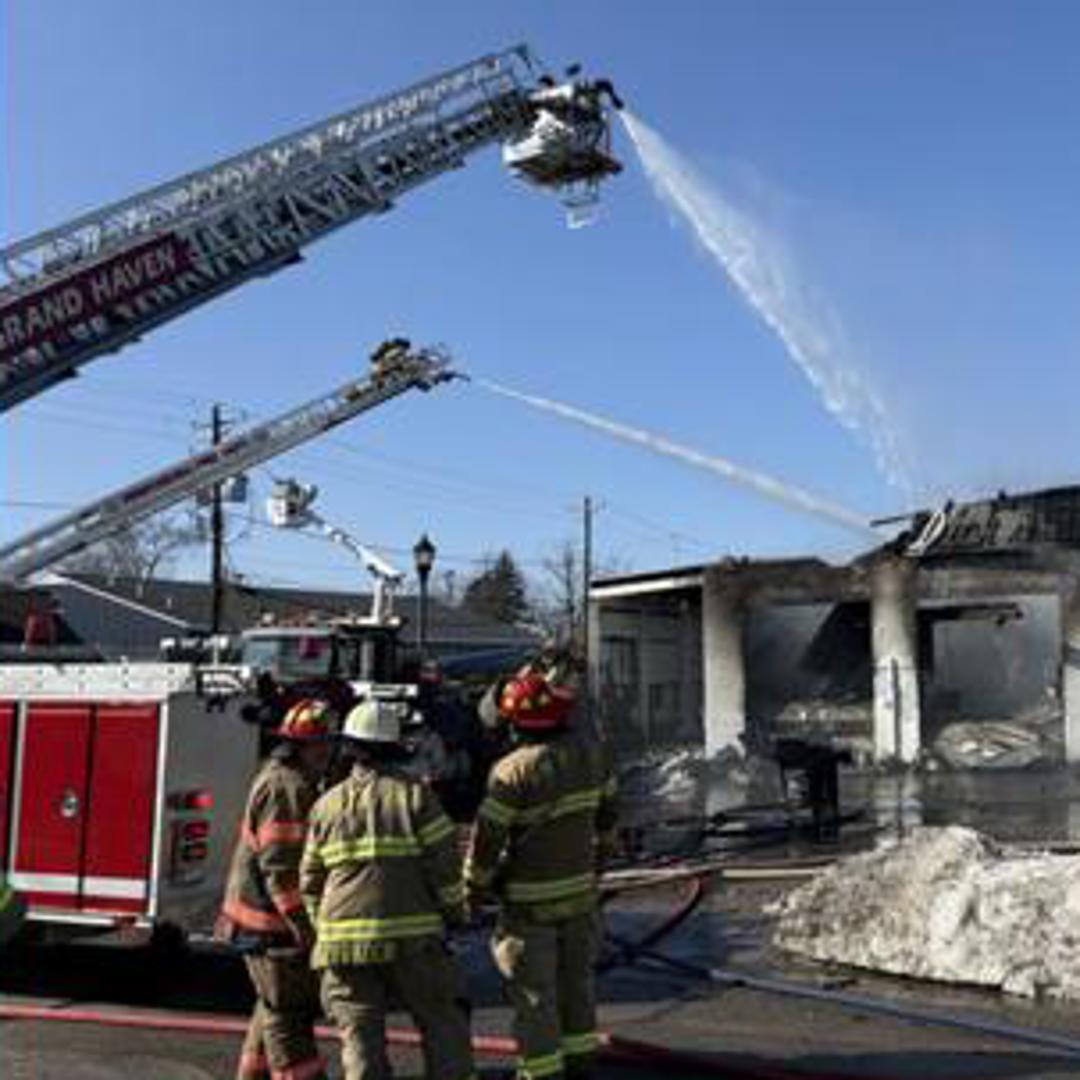 Grand Haven towing company a 'total loss' after fire | wzzm13.com