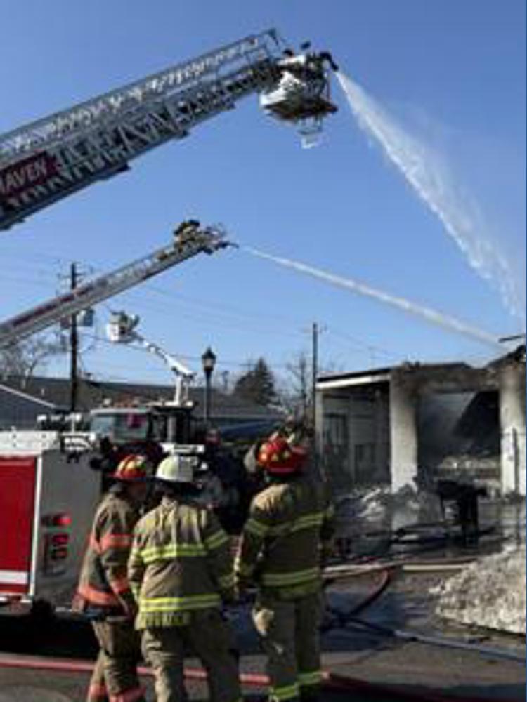 Grand Haven towing company a 'total loss' after fire | wzzm13.com
